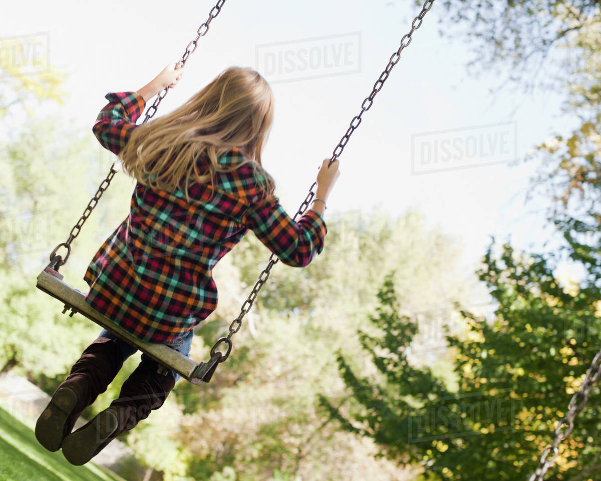 USA, Utah, girl (6-7) swinging on tree swing - Royalty-free Stock Photo ...