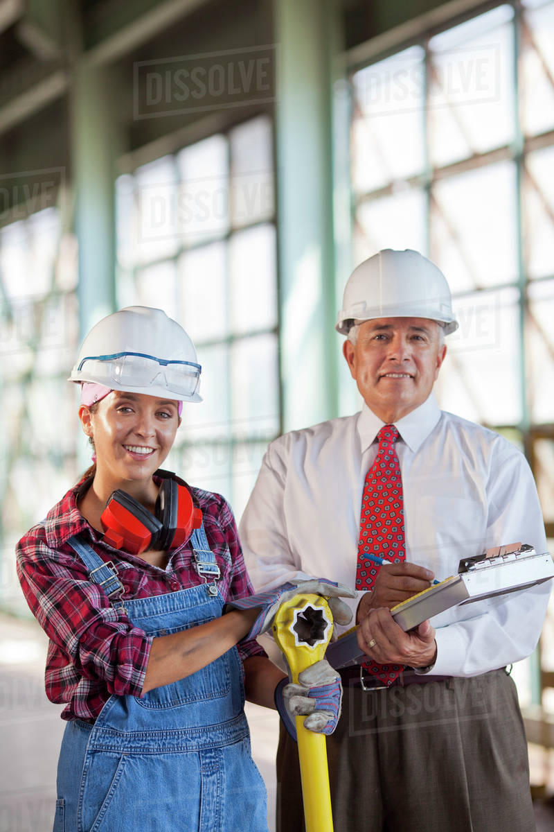 Portrait of manual worker and manager - Stock Photo - Dissolve
