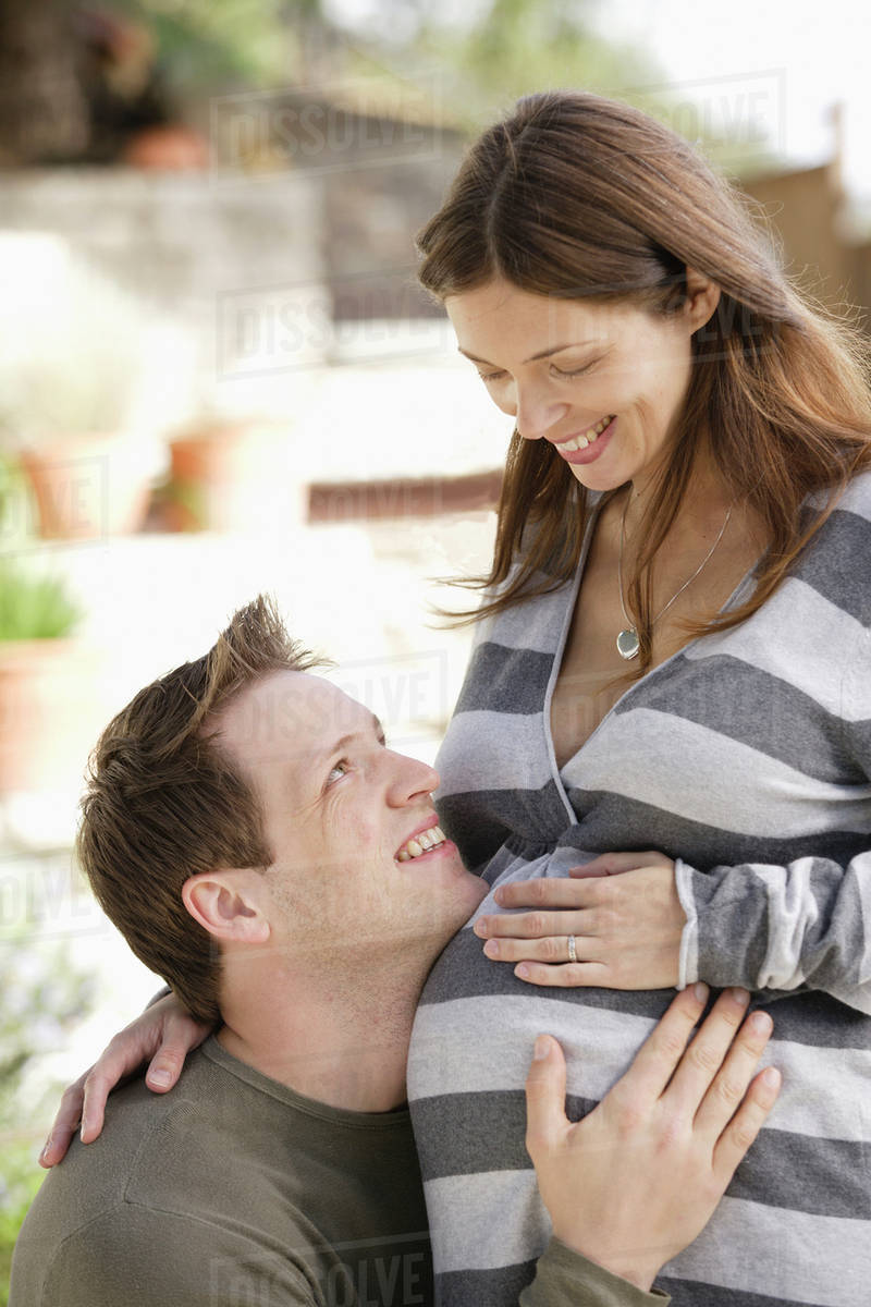 Portrait of expecting couple - Stock Photo - Dissolve