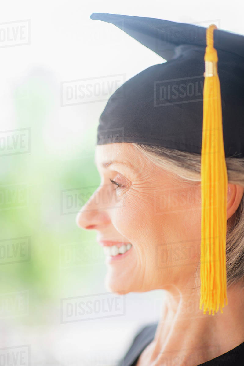 Portrait of woman in graduation cap - Royalty-free Stock Photo | Dissolve