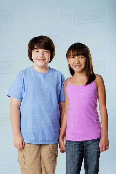 Studio portrait of boy and girl (10-11) - Royalty-free Stock Photo ...
