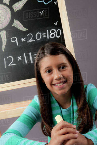 Studio portrait of girl (8-9) next to blackboard - Royalty-free Stock ...