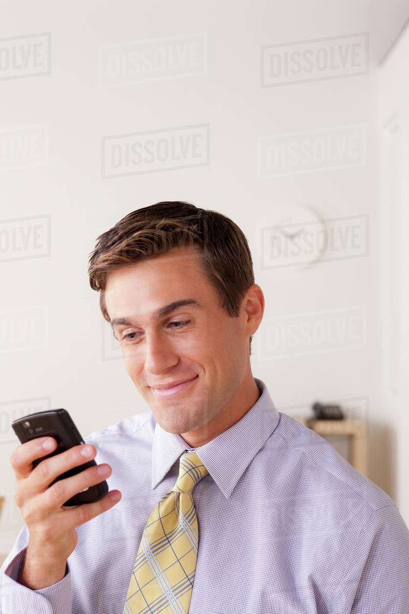Businessman text-messaging - Royalty-free Stock Photo | Dissolve