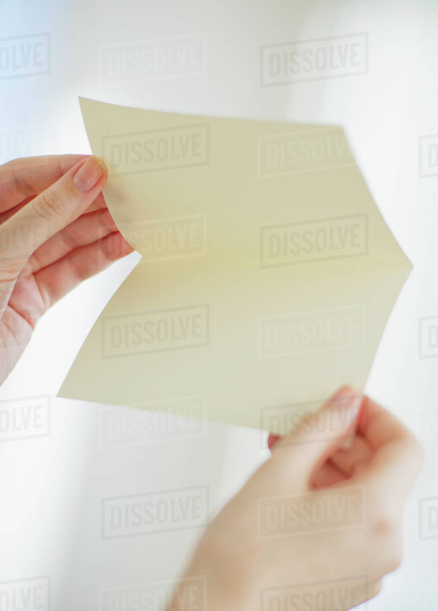 Hands opening a blank card - Royalty-free Stock Photo | Dissolve