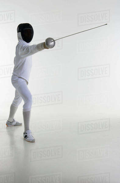 Studio portrait of fencer holding fencing foil - Royalty-free Stock ...