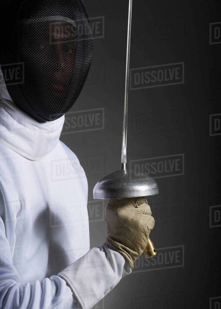 Studio portrait of fencer holding fencing foil - Royalty-free Stock ...