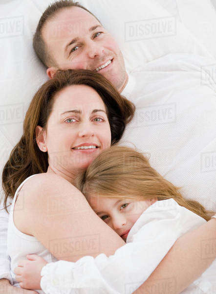 Family cuddling - Royalty-free Stock Photo | Dissolve