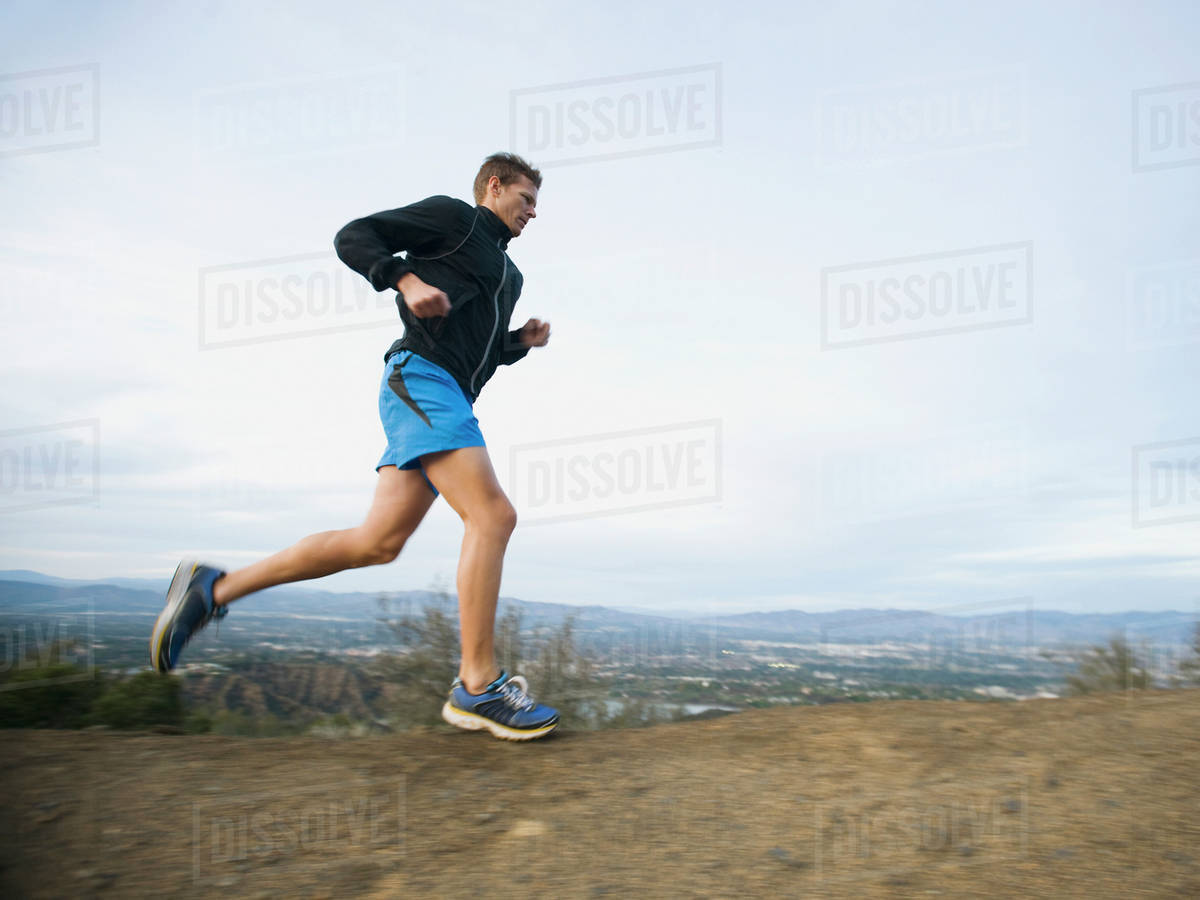 Person running on trail - Royalty-free Stock Photo | Dissolve