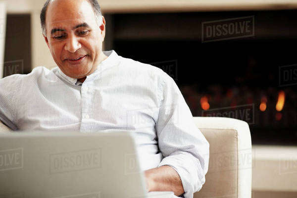 Man working on laptop - Stock Photo - Dissolve