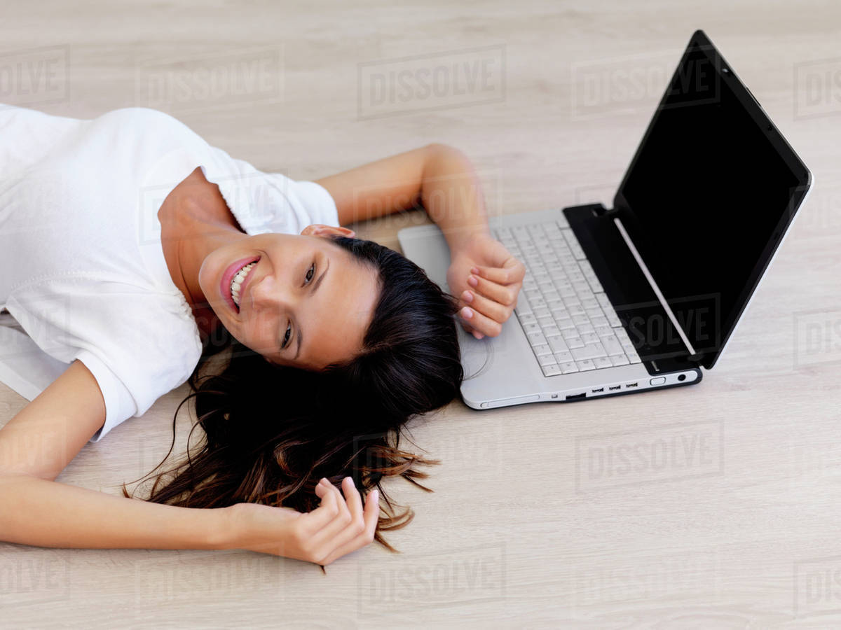 Woman relaxing on floor - Royalty-free Stock Photo | Dissolve