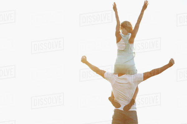 Man carrying woman on his shoulders - Royalty-free Stock Photo | Dissolve