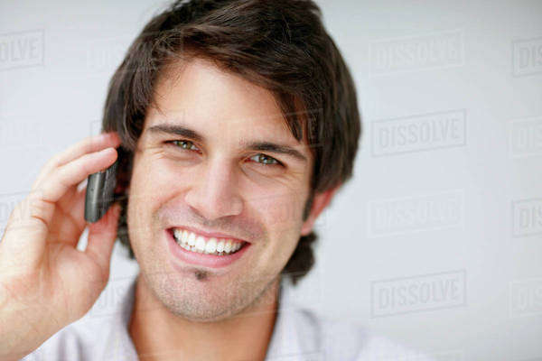 Handsome man talking on cell phone - Royalty-free Stock Photo | Dissolve