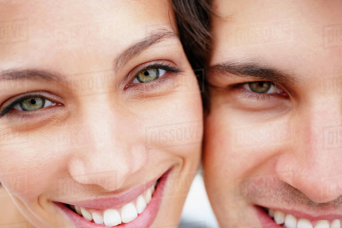 Cropped picture of a smiling couple - Royalty-free Stock Photo | Dissolve