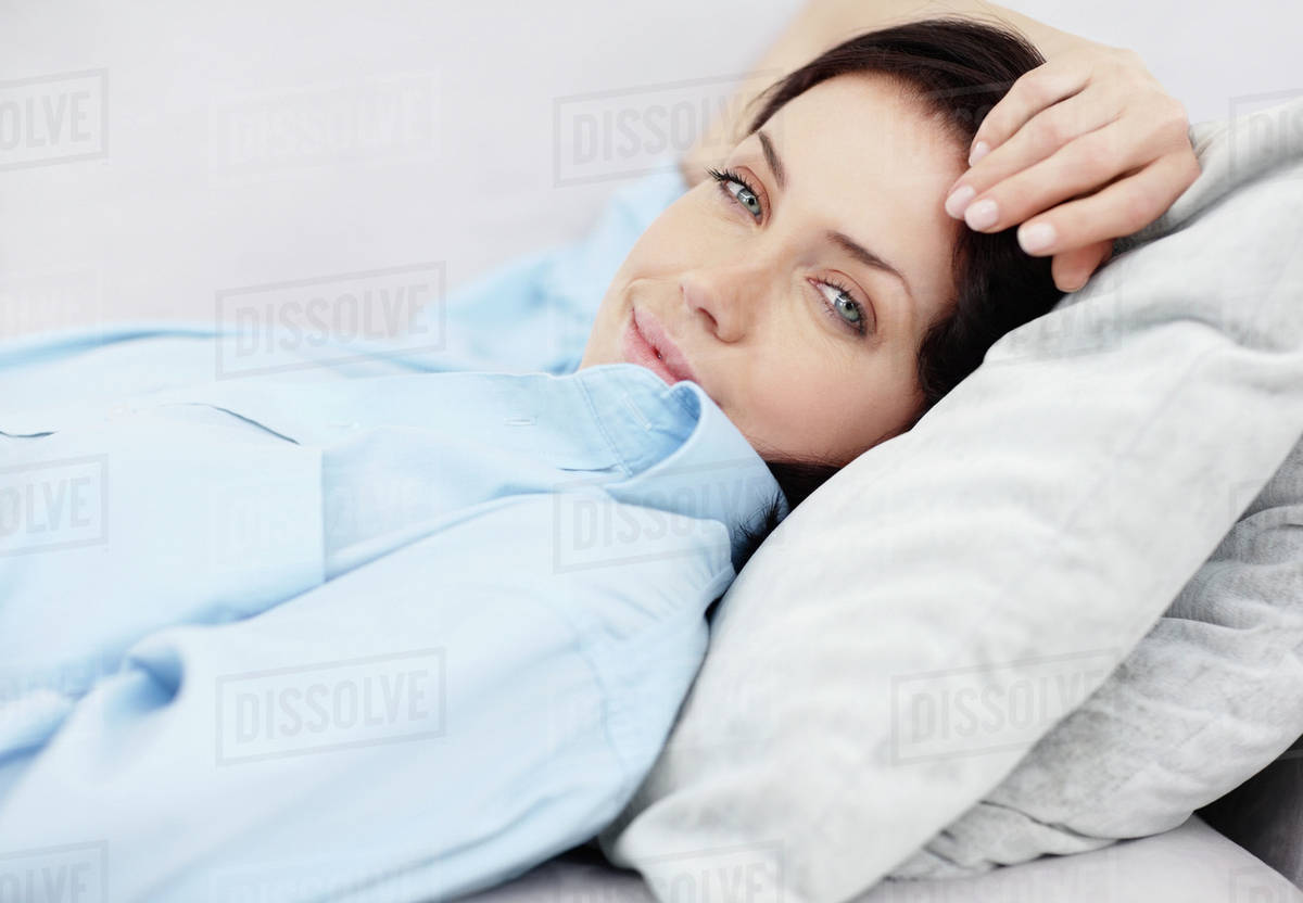 Brunette woman resting - Royalty-free Stock Photo | Dissolve