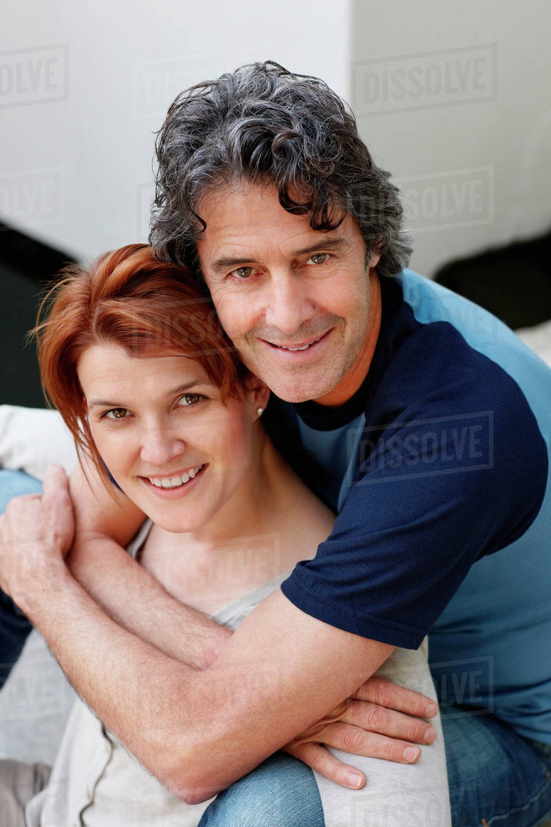 Happy couple embracing - Royalty-free Stock Photo | Dissolve