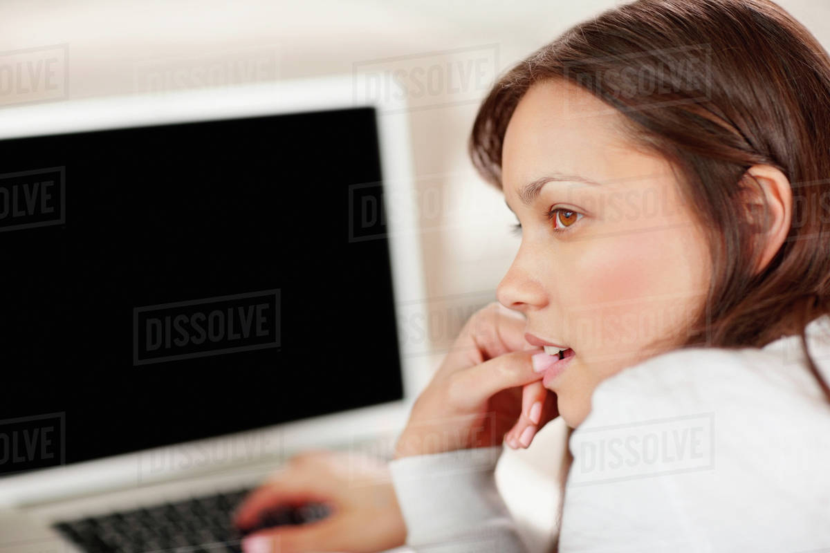 Woman browsing the internet - Royalty-free Stock Photo | Dissolve