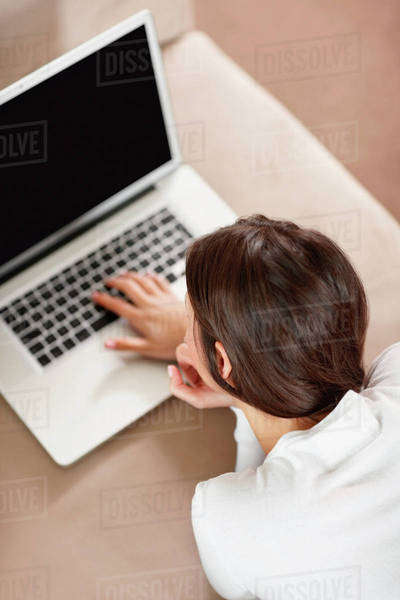Woman browsing the internet - Royalty-free Stock Photo | Dissolve