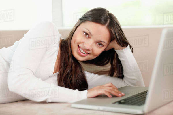 Woman browsing the internet - Stock Photo - Dissolve
