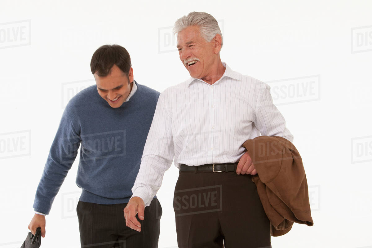 Two happy men walking together - Stock Photo - Dissolve