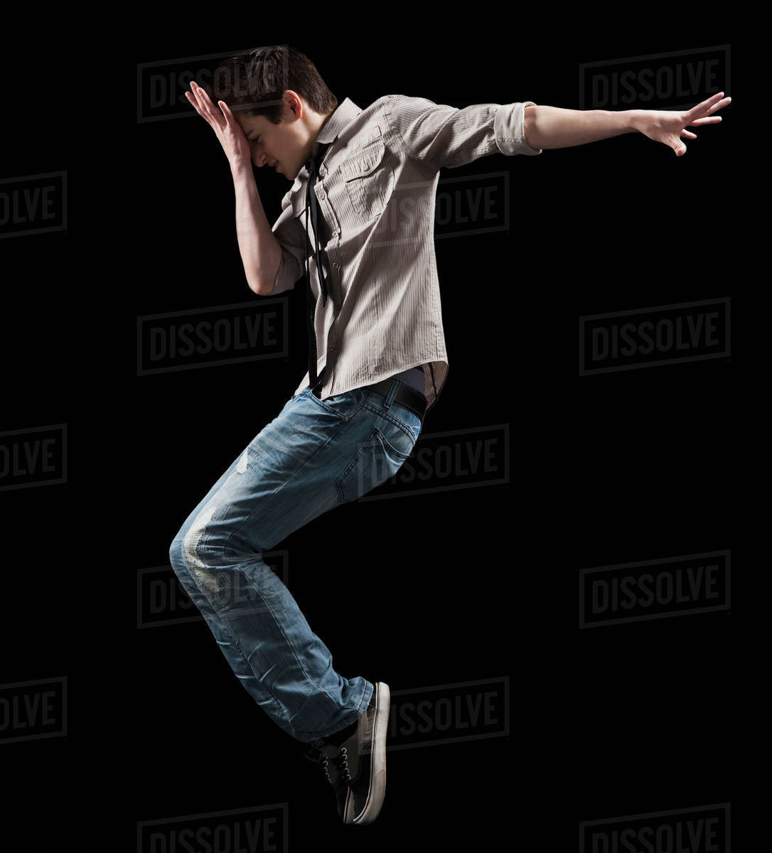 Male dancer jumping in the air - Royalty-free Stock Photo | Dissolve