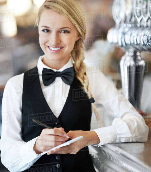 Portrait of smiling waitress - Stock Photo - Dissolve