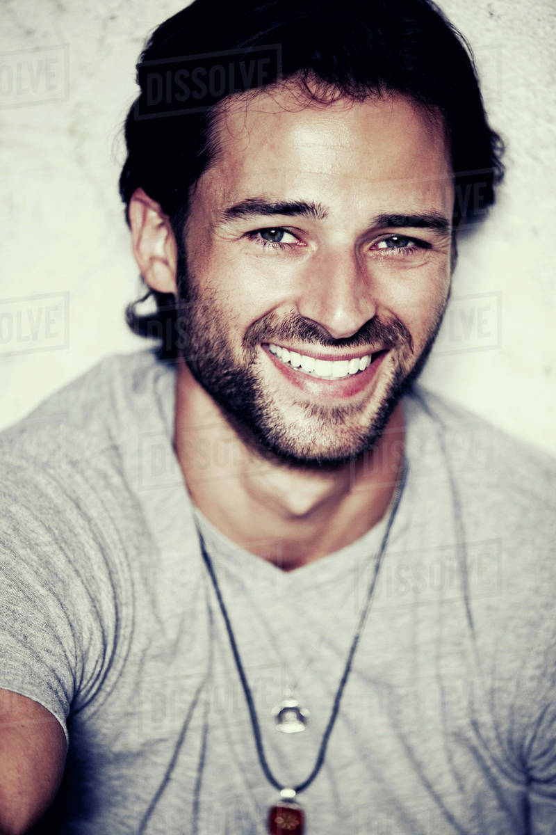 Portrait of smiling man - Stock Photo - Dissolve