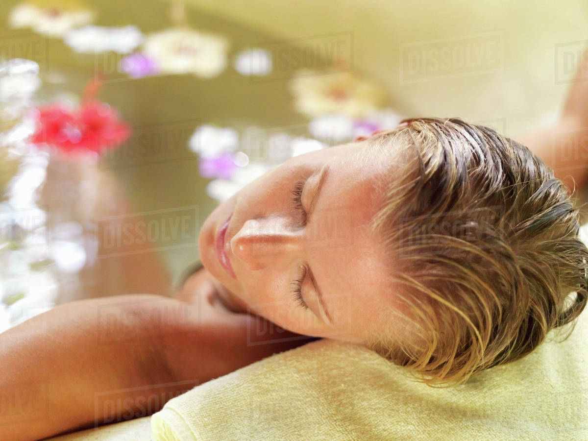 Woman relaxing in bathtub - Stock Photo - Dissolve
