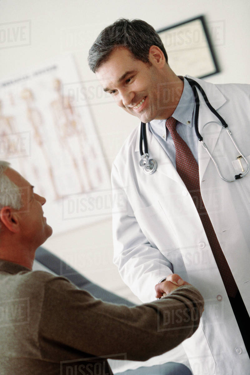 Doctor talking to patient - Royalty-free Stock Photo | Dissolve