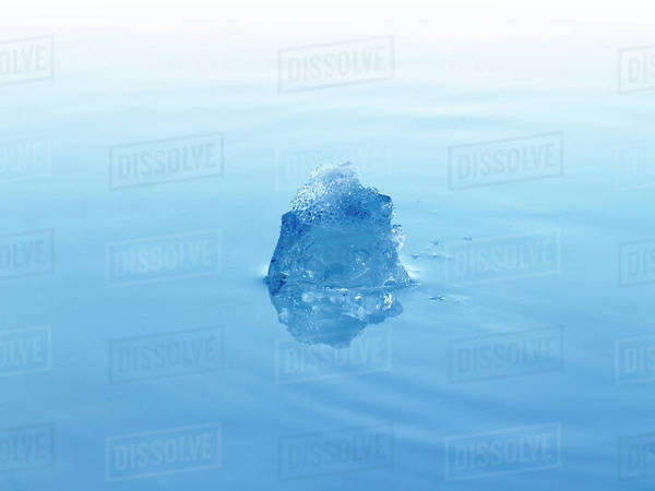 Ice cube in water - Royalty-free Stock Photo | Dissolve