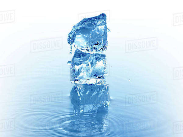 Stack of ice cubes in water - Royalty-free Stock Photo | Dissolve