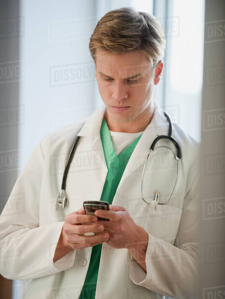 Doctor text messaging - Royalty-free Stock Photo | Dissolve
