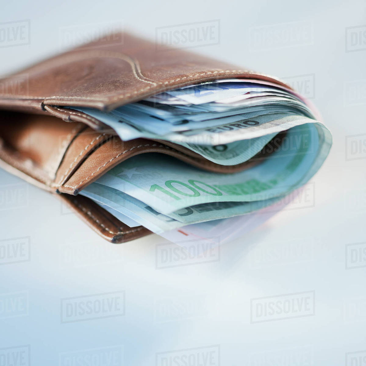 Wallet stuffed with euros - Royalty-free Stock Photo | Dissolve