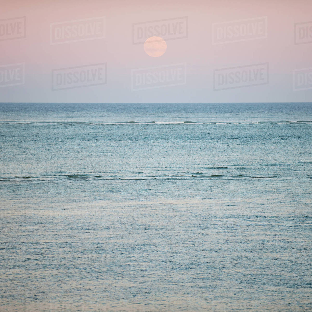 Moonrise over ocean - Stock Photo - Dissolve