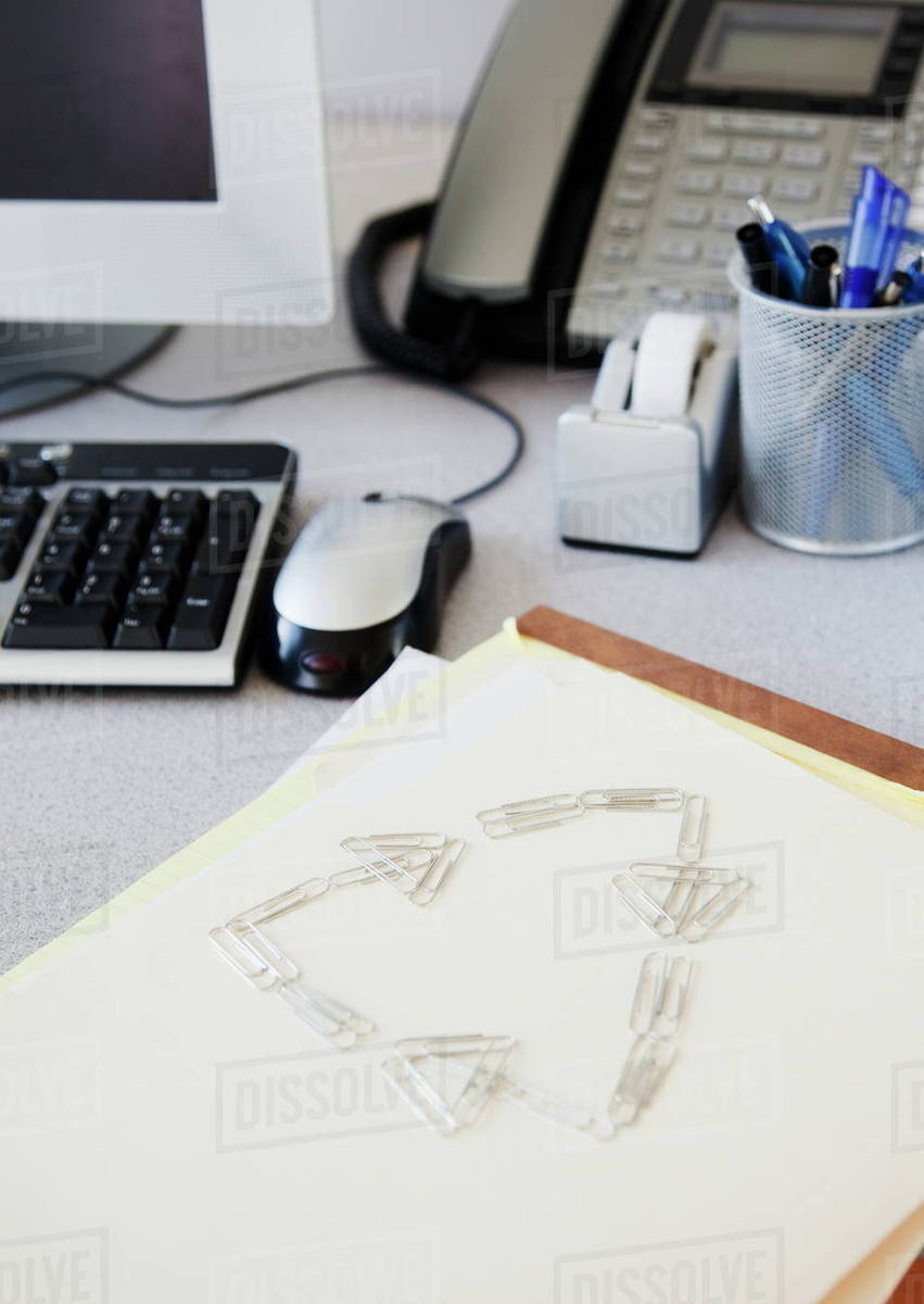 Recycling symbol made of paper clips - Stock Photo - Dissolve
