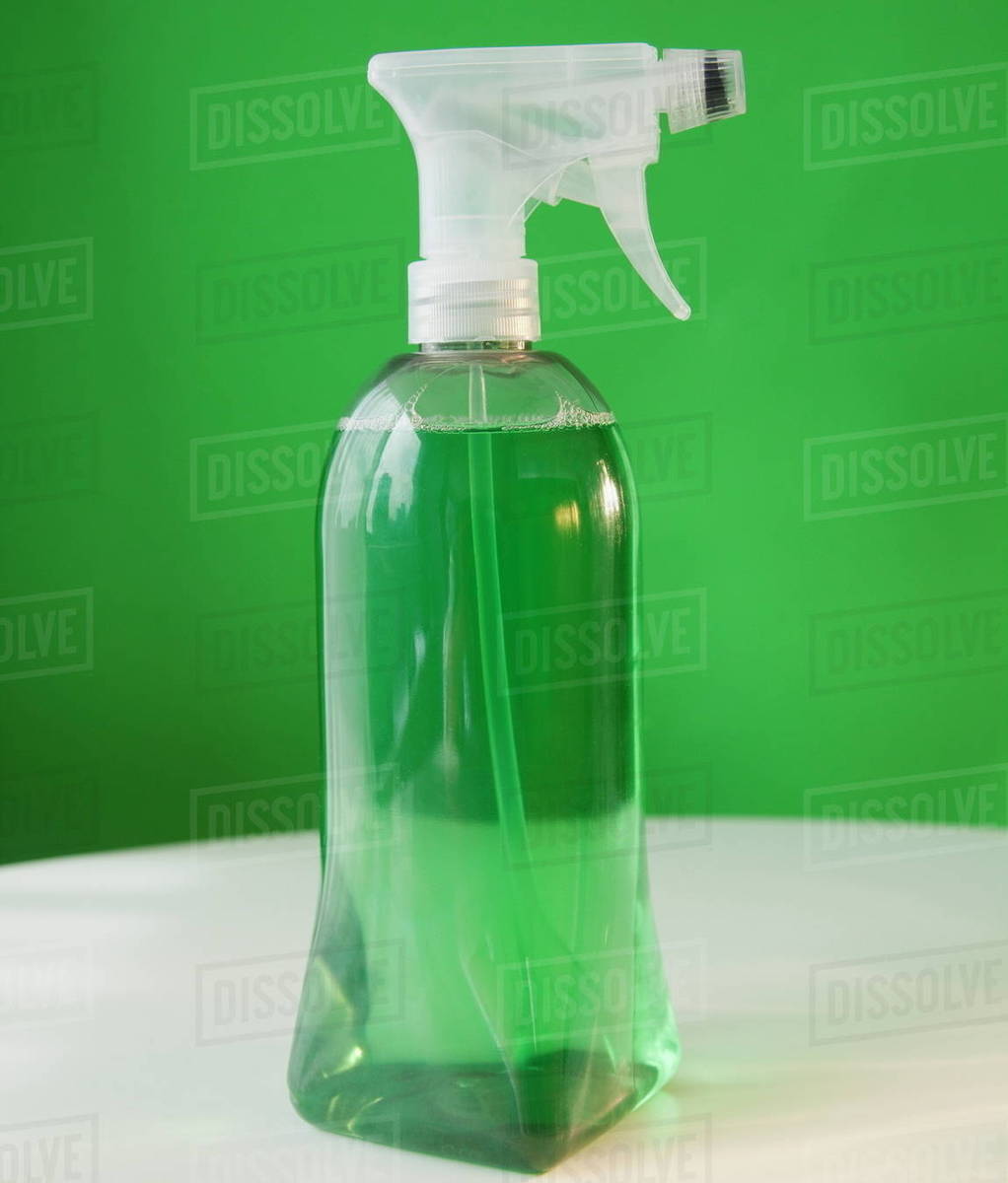 Green liquid spray bottle - Royalty-free Stock Photo | Dissolve