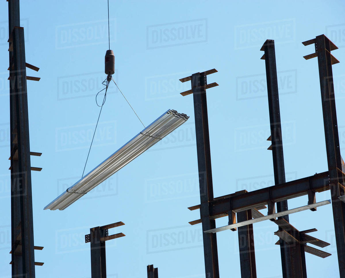 Crane moving steel at construction site - Royalty-free Stock Photo ...
