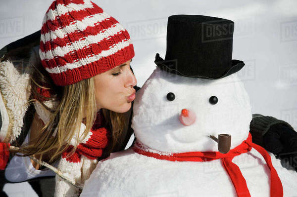A woman with a snowman - Royalty-free Stock Photo | Dissolve