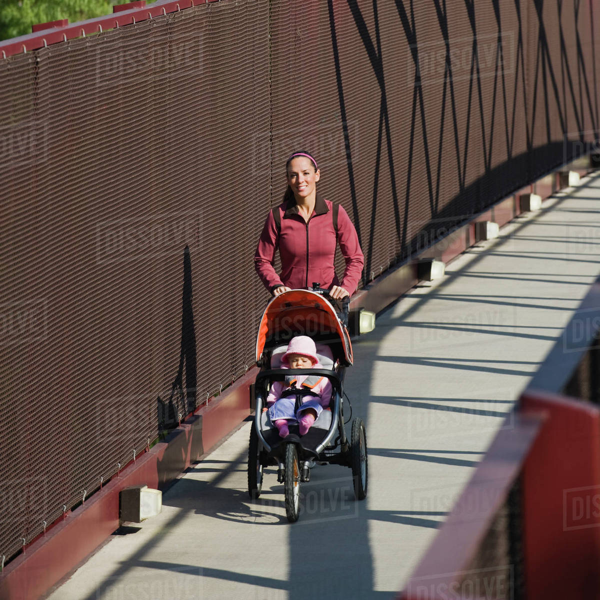 Woman jogging with stroller - Royalty-free Stock Photo | Dissolve