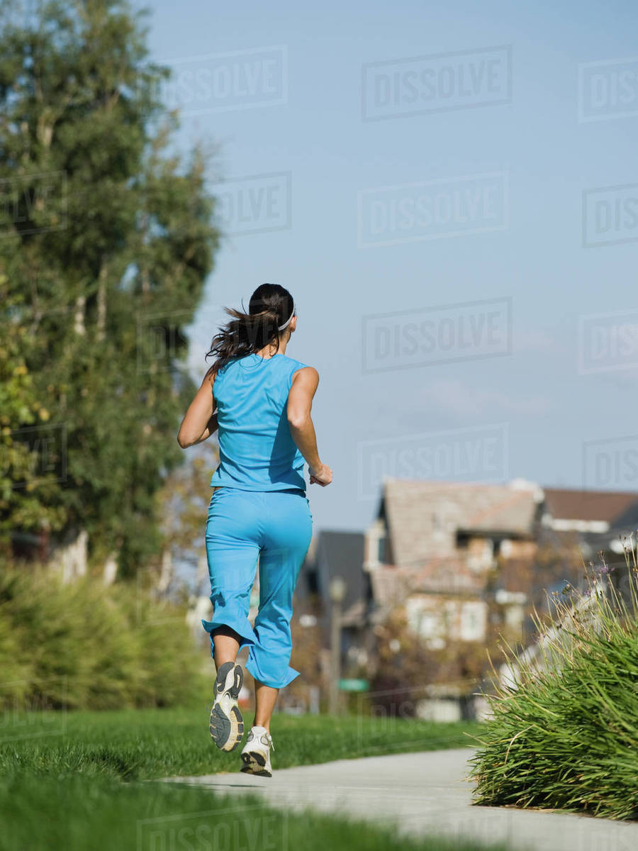 Woman jogging - Royalty-free Stock Photo | Dissolve