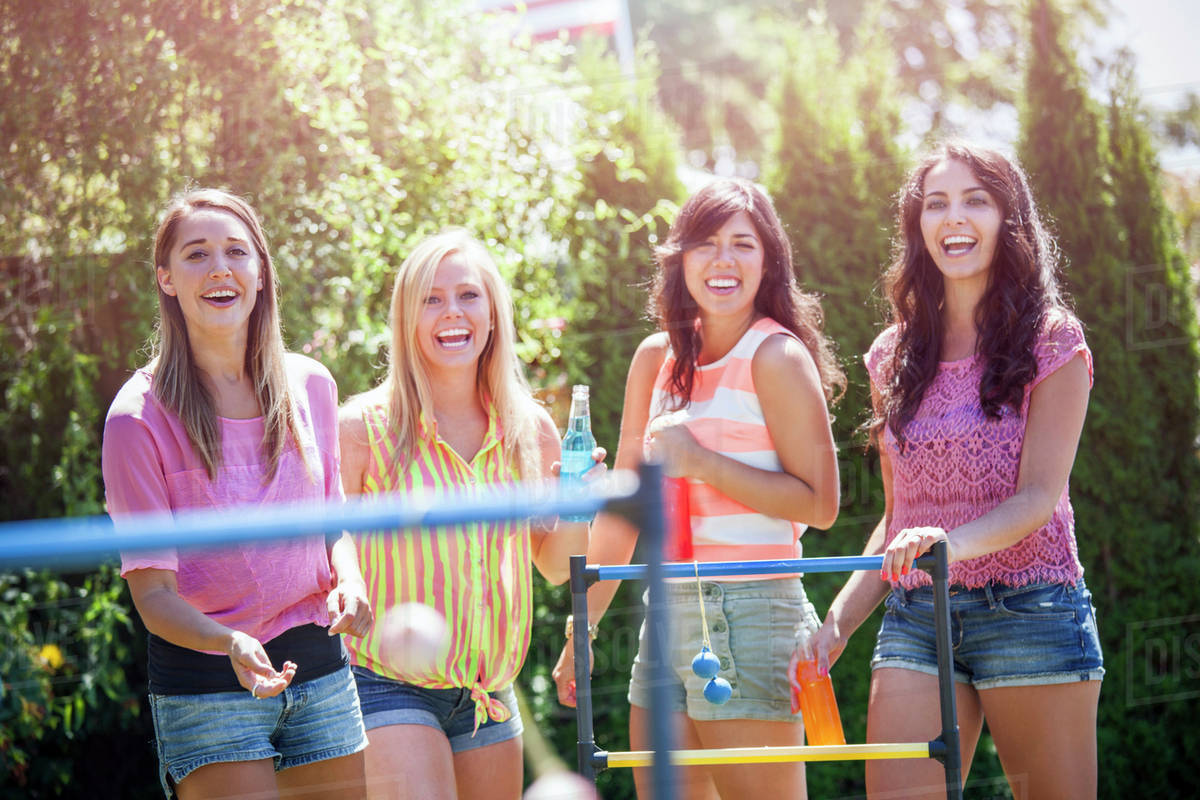 Portrait of young women throwing balls - Royalty-free Stock Photo ...