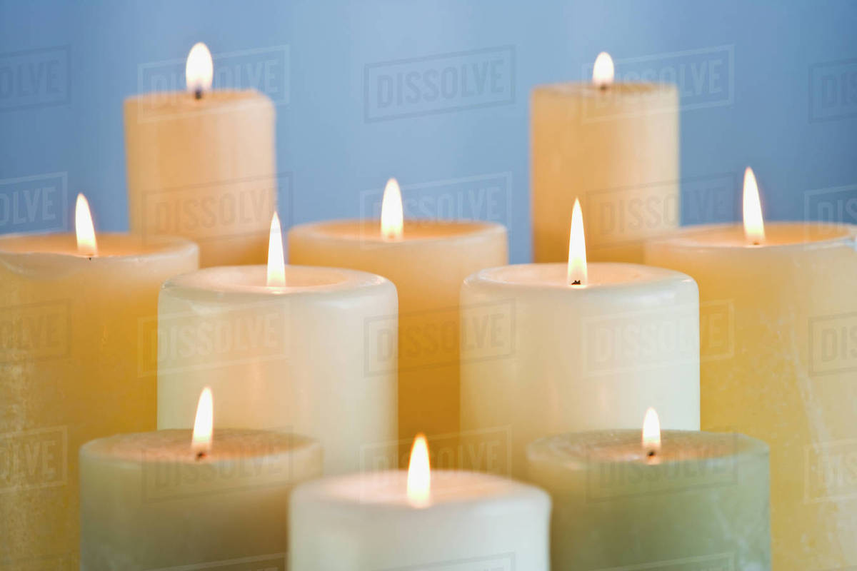 Close up of lit candles - Stock Photo - Dissolve