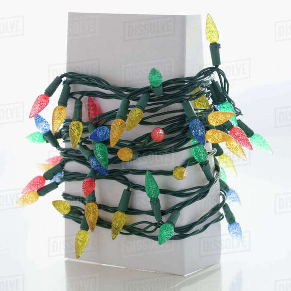 Christmas lights wrapped around box - Stock Photo - Dissolve