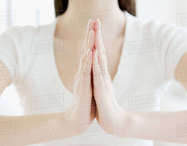 Close up of woman’s hands with palms pressed together - Royalty-free ...