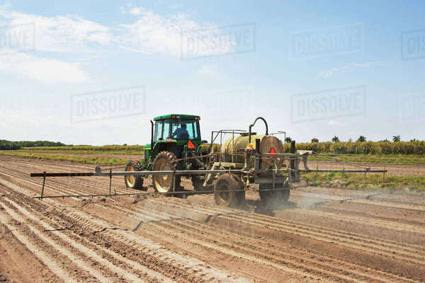 Tractor spraying field, Florida, United States - Royalty-free Stock ...