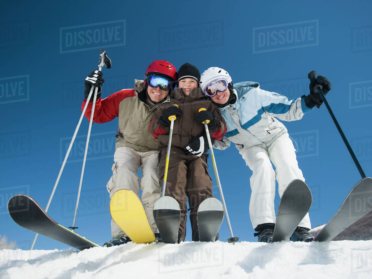 Family standing on skis - Royalty-free Stock Photo | Dissolve