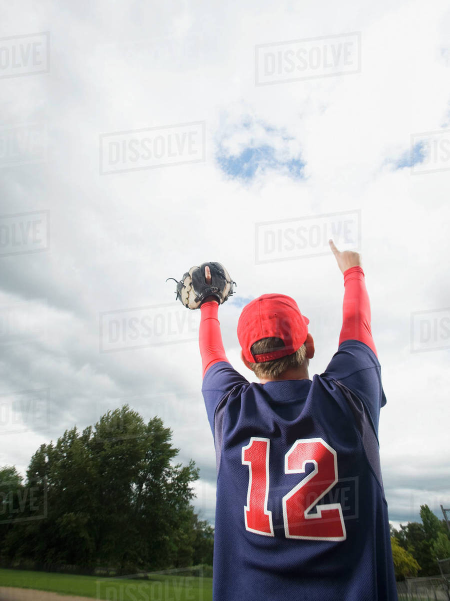 Baseball player celebrating with arms raised - Royalty-free Stock Photo ...