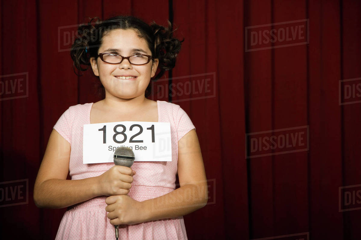 Girl wearing number on stage - Royalty-free Stock Photo | Dissolve