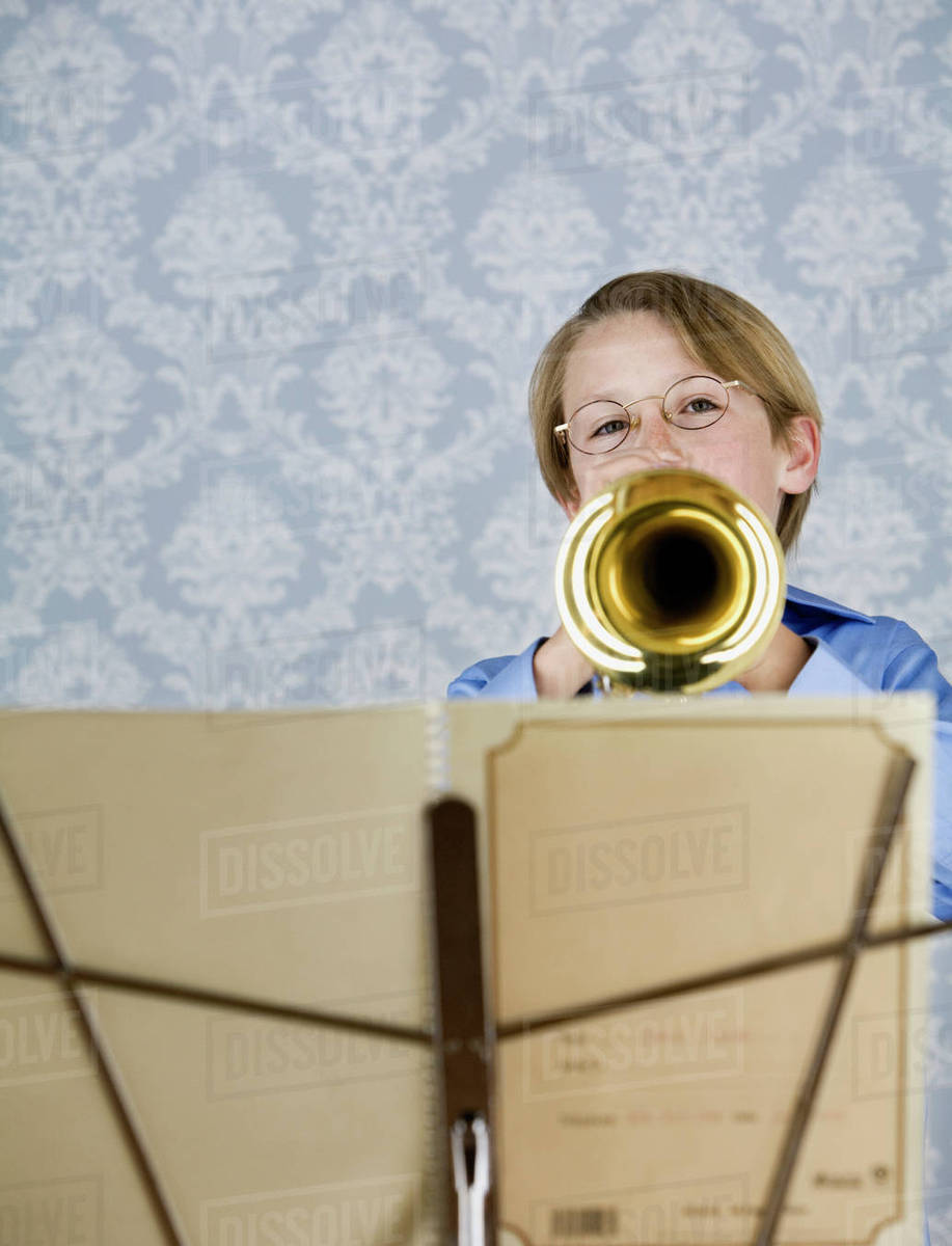 Boy playing trumpet - Royalty-free Stock Photo | Dissolve