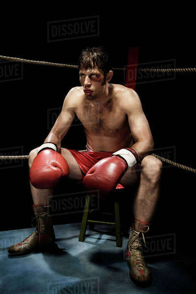 Boxer sitting on stool in corner of boxing ring - Royalty-free Stock ...
