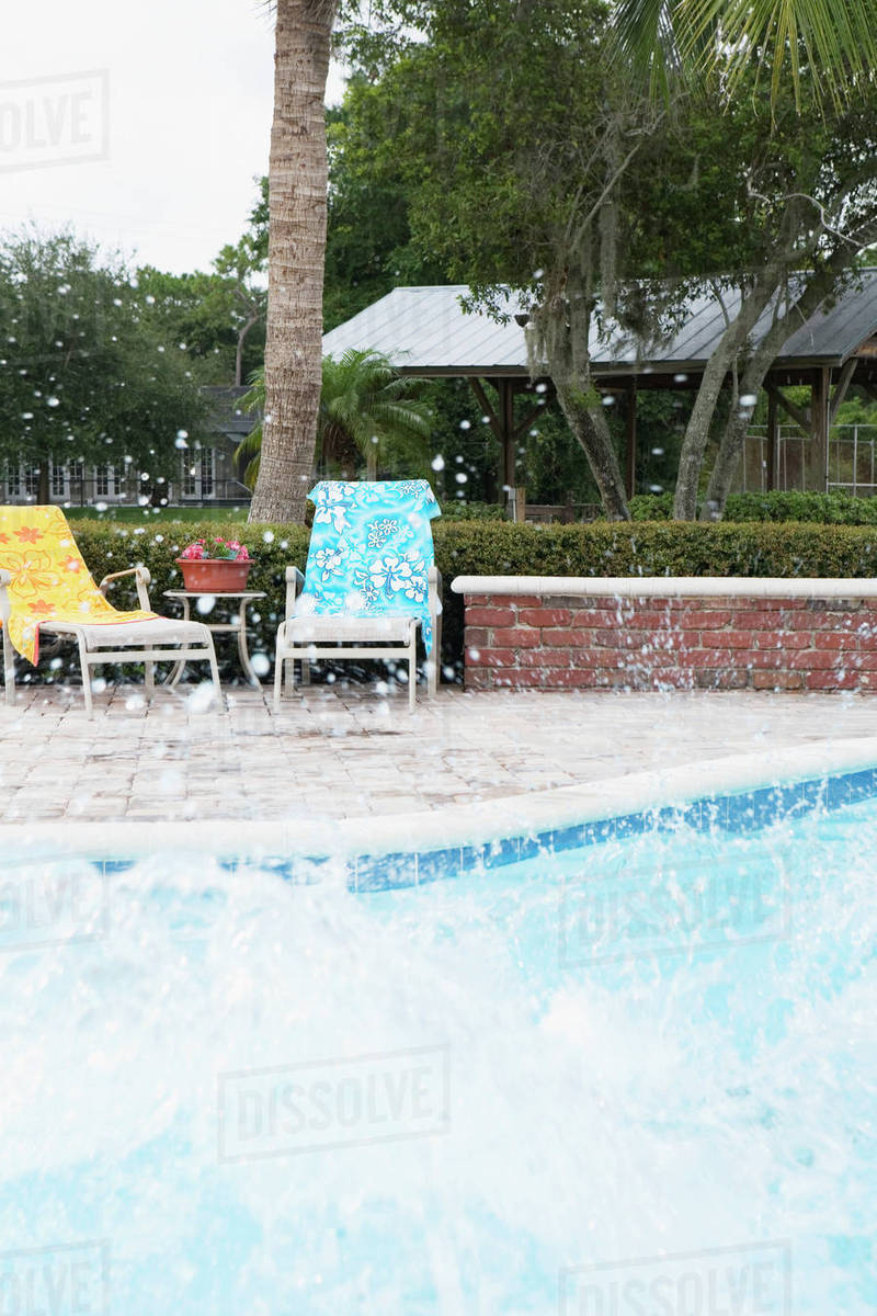 Big splash in swimming pool - Royalty-free Stock Photo | Dissolve